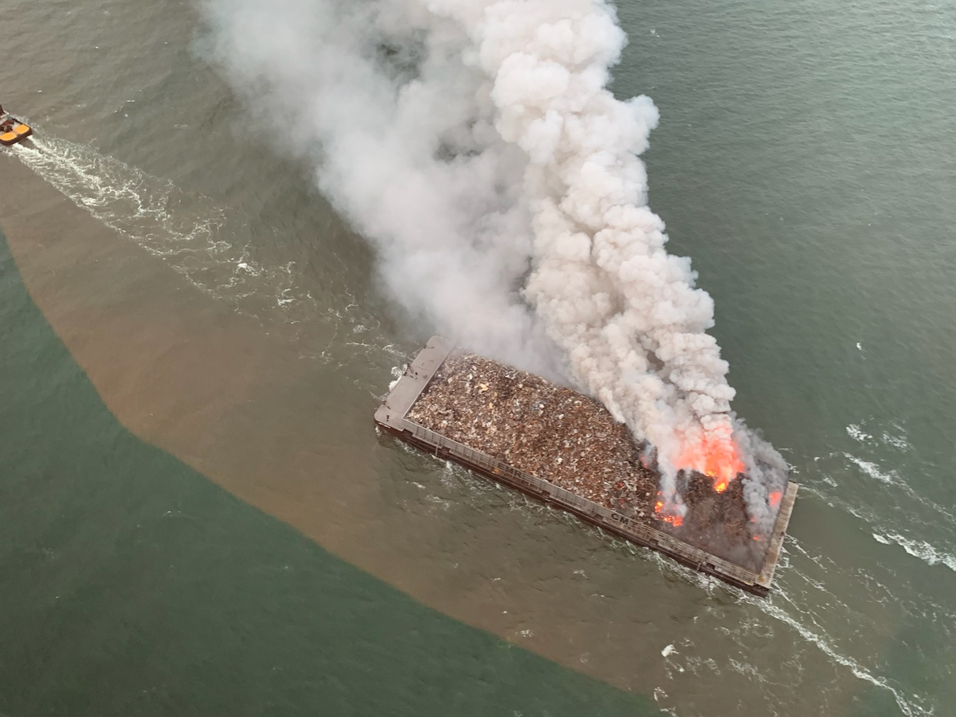 Firefighters, Coast Guard extinguish intense barge fire in Delaware Bay ...